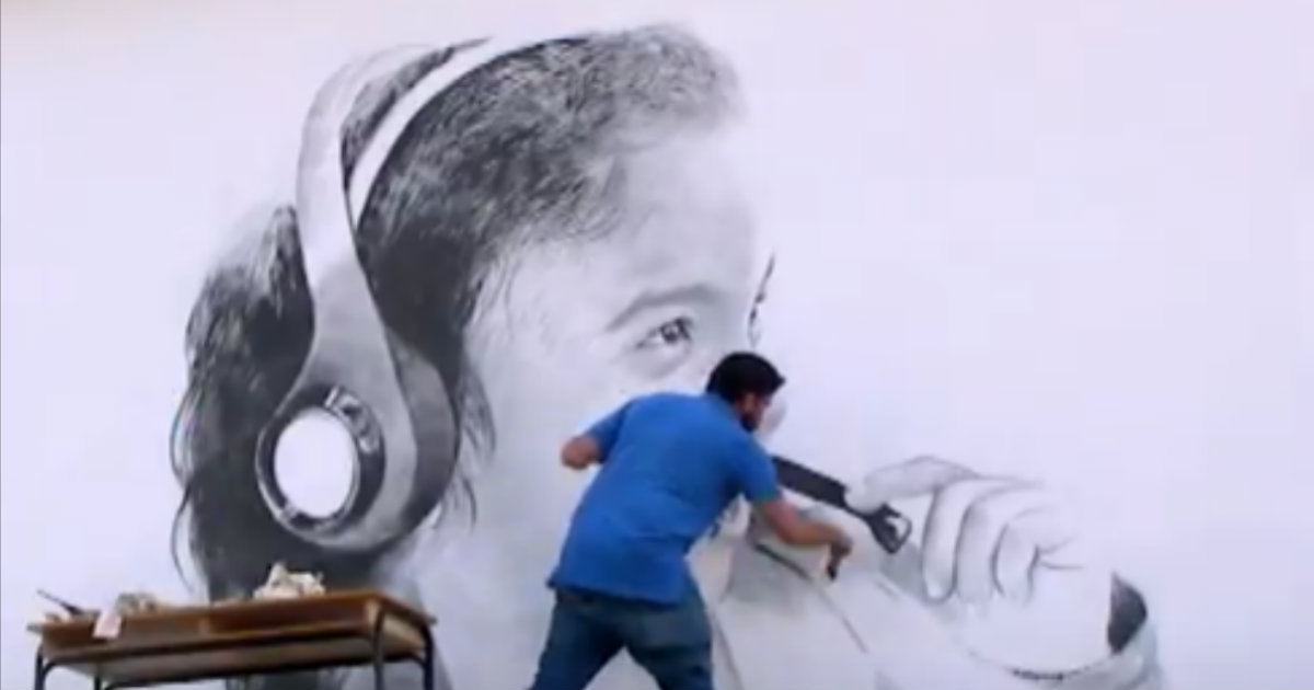 Pintor cubano realiza murales con rostros infantiles en las calles de Cuba
